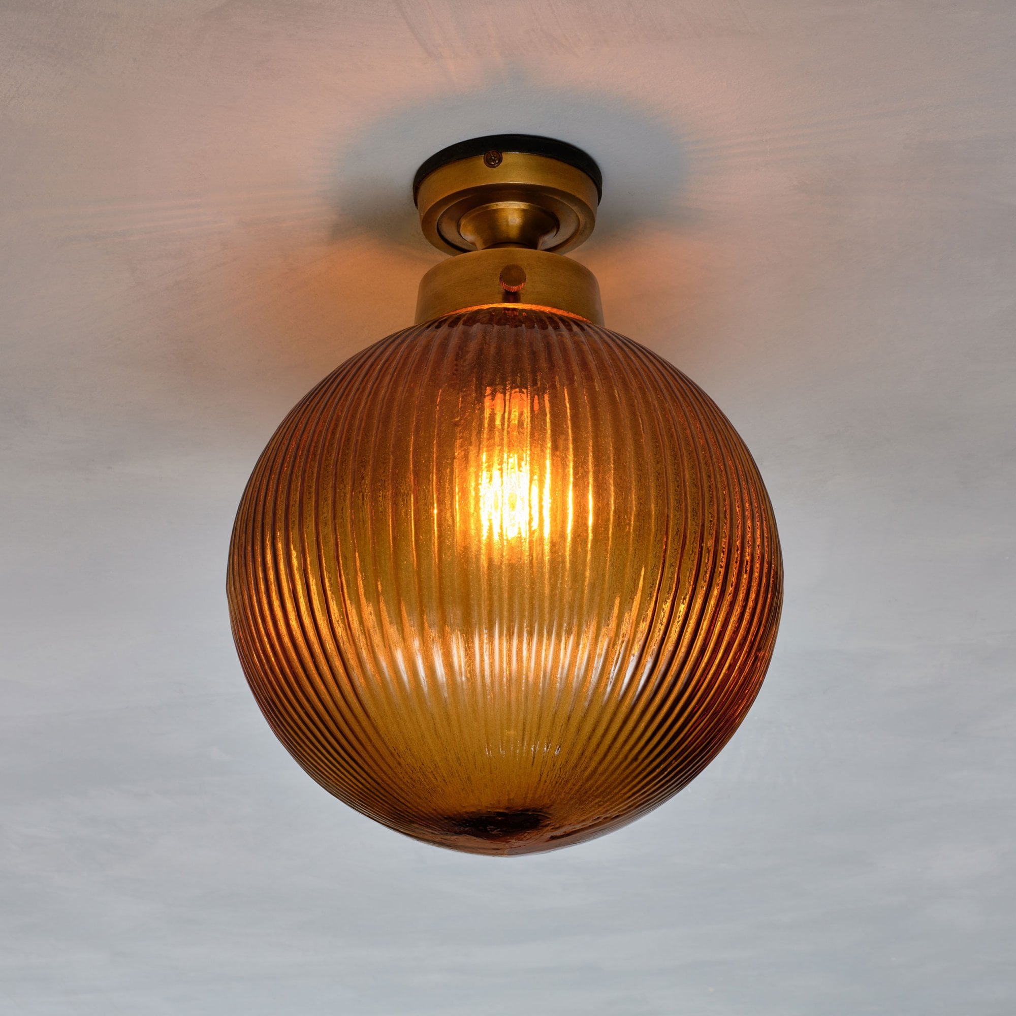 Nkuku Konnie Amber Glass Bathroom Ceiling Light In Antique Brass | Dusk ...